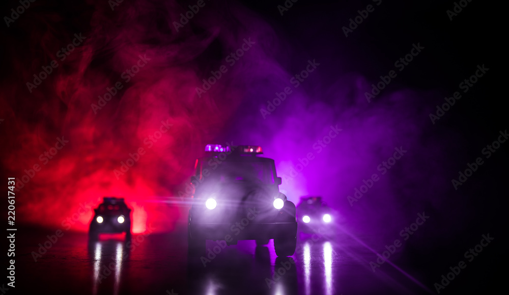 Police car chasing a car at night with fog background. 911 Emergency ...