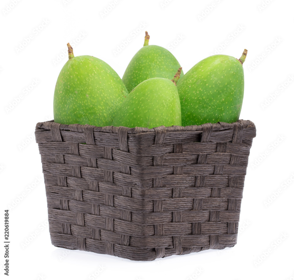 Bamboo basket of fresh mango isolated on a white background. Stock ...