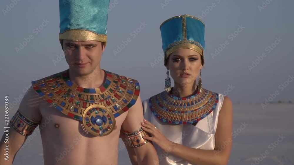A beautiful couple in the desert, a man of Egyptian pharaoh and his ...