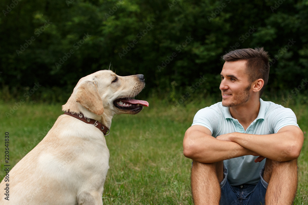 Friendship of man and dog. Happy young man and his friend - dog ...