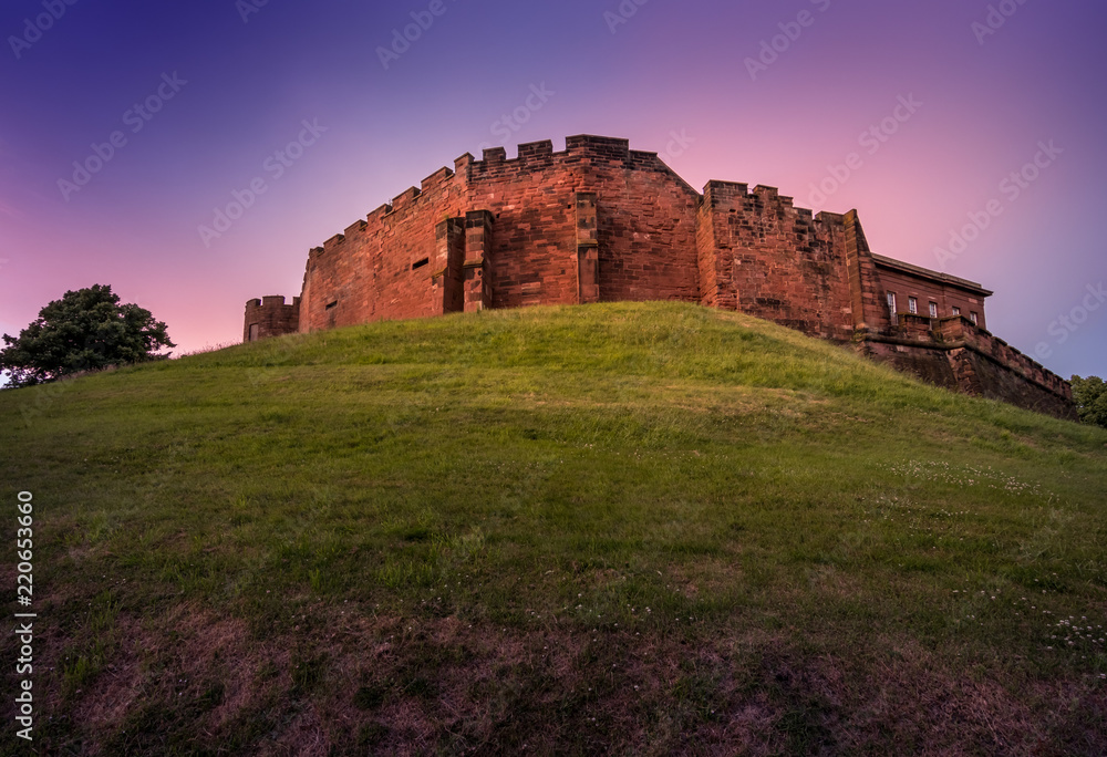 Chester medieval Castle at sunset, beyond the city wall. The castle and ...