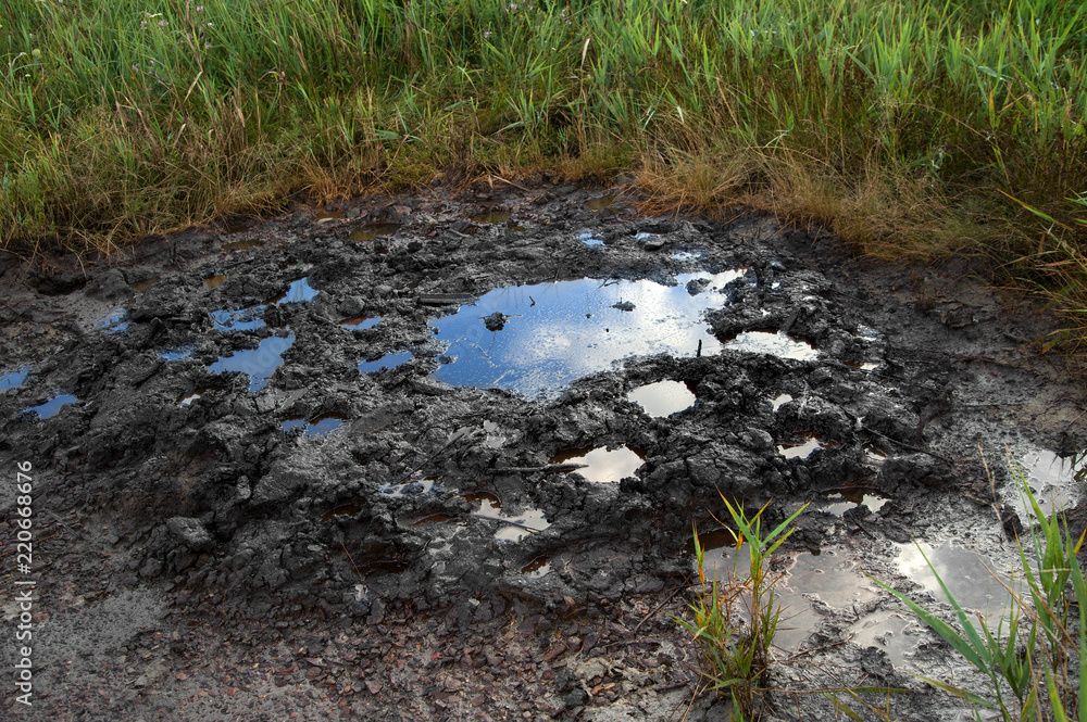 Spills of crude oil on the soil surface - environment pollution. Stock ...