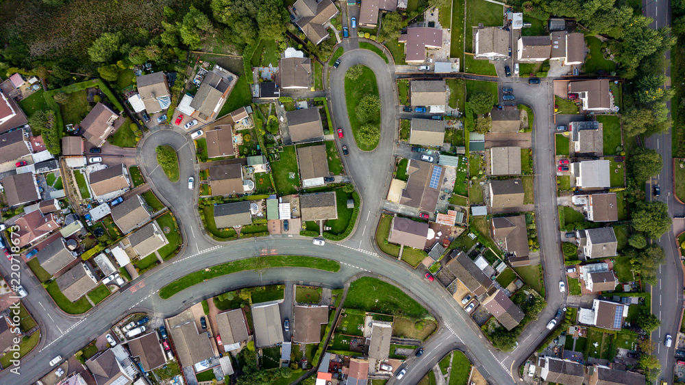 Top down aerial view of urban houses and streets in a residential area ...