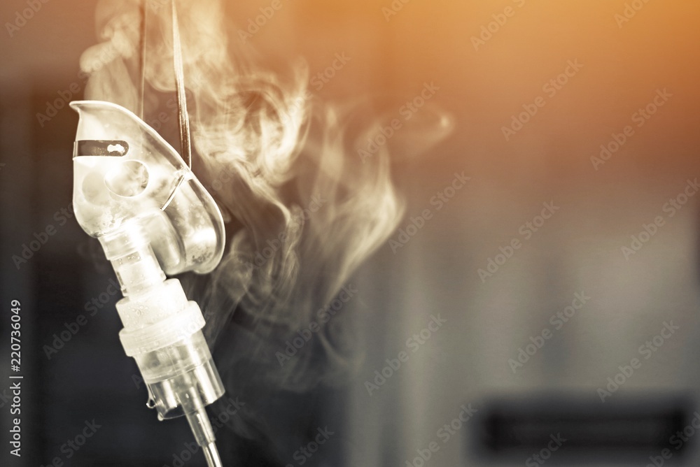 Medical inhaler emergency equipment blue back smoke background ...