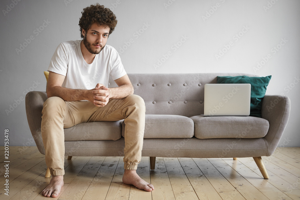 Indoor portrait of fashionable self employed young bearded man in ...