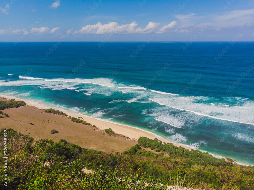 Top aerial view of beauty Bali beach. Empty paradise beach, blue sea ...