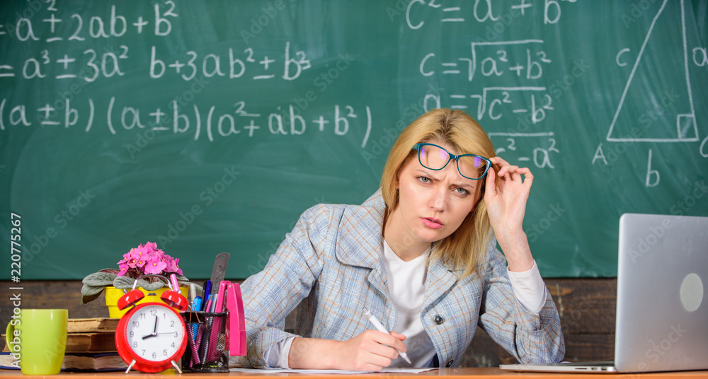 She has doubts in your report or knowledge. Teacher woman sit table ...