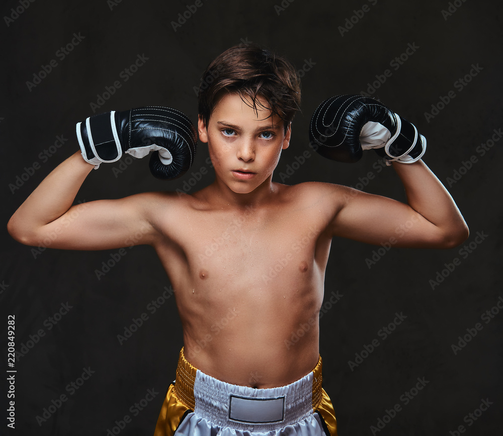 Handsome shirtless young boxer wearing gloves showing muscles. Stock ...