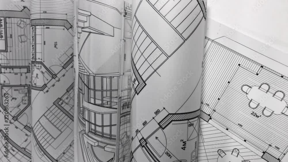 Blueprints - rolls of architectural drawings smoothly rotate on the ...