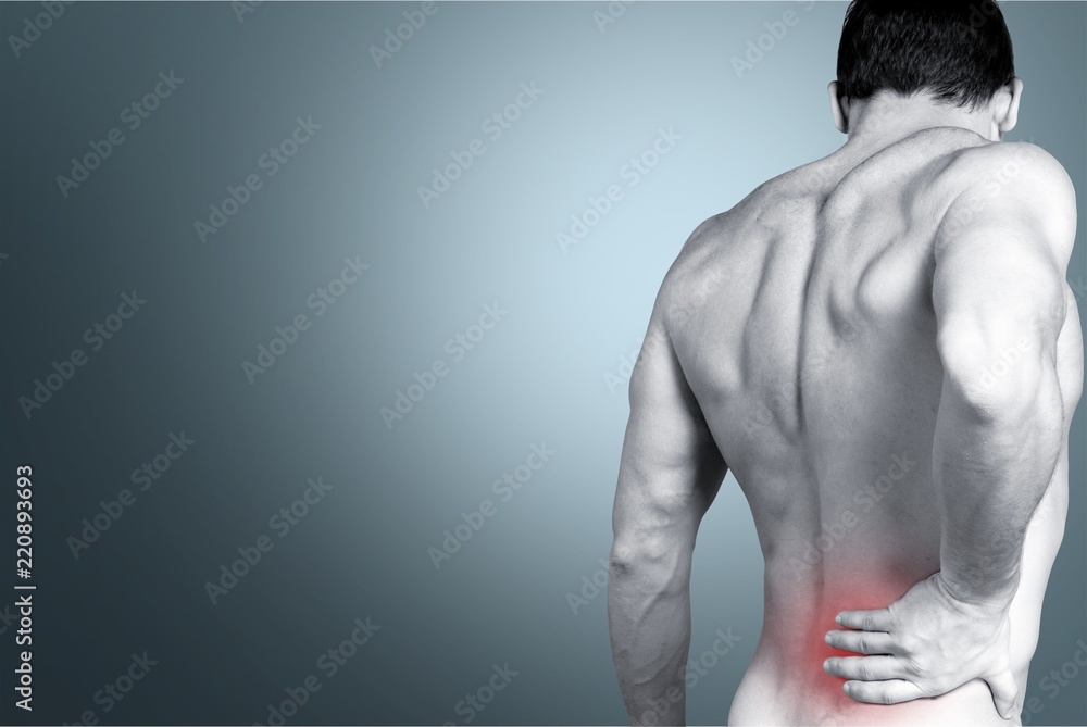 Back view of shirtless man touching his aching back Stock Photo | Adobe ...
