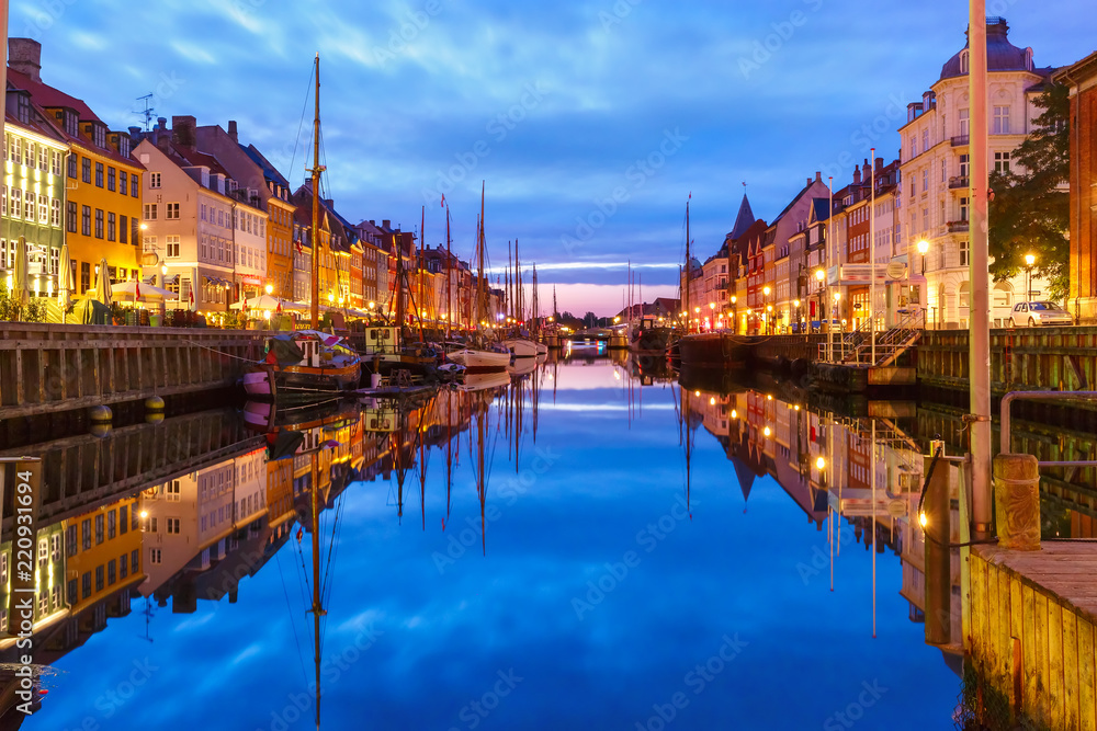 Panorama of Nyhavn with colorful facades of old houses and old ships in ...