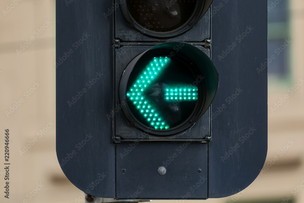 Green arrow left-turn traffic signal Stock Photo | Adobe Stock