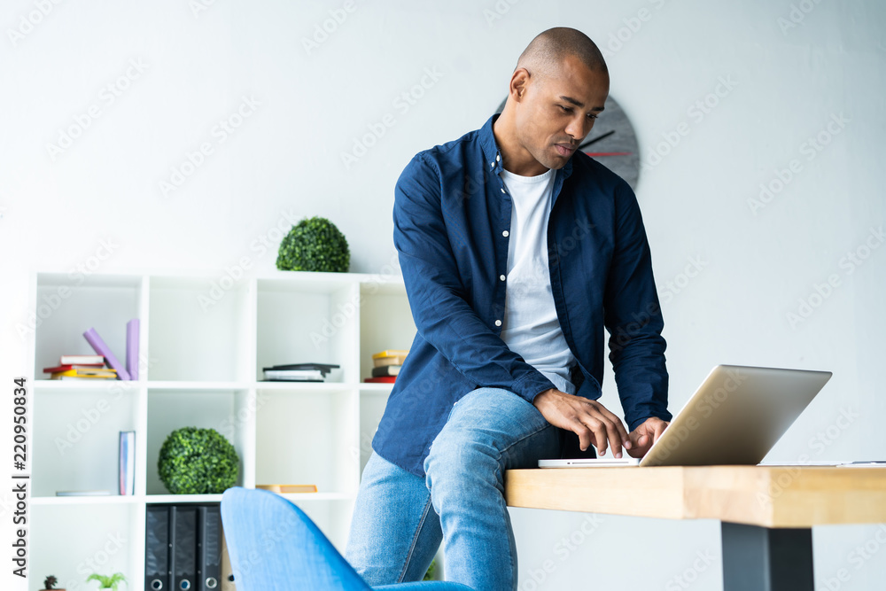 Image of african american businessman working on his laptop. Handsome ...