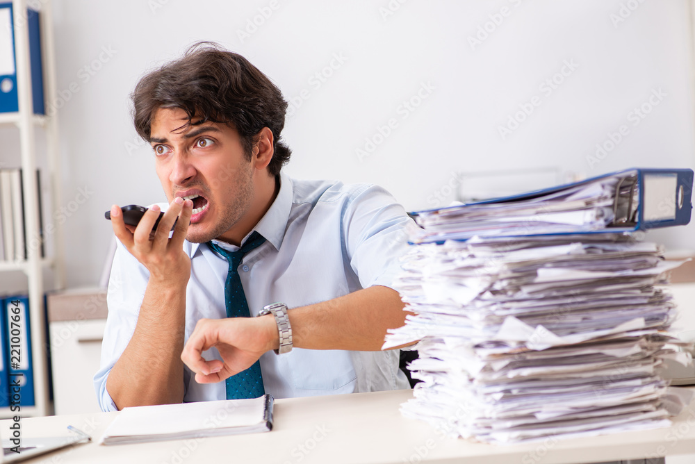 Overloaded busy employee with too much work and paperwork Stock Photo ...