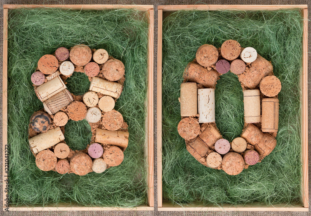 Number 80 eighty made of wine corks on green background in wooden box ...