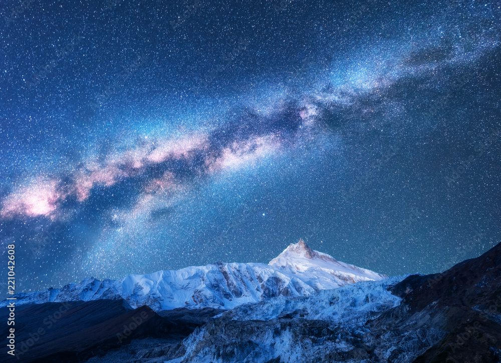 Milky Way above snowy mountains. Space. Fantastic view with snow ...