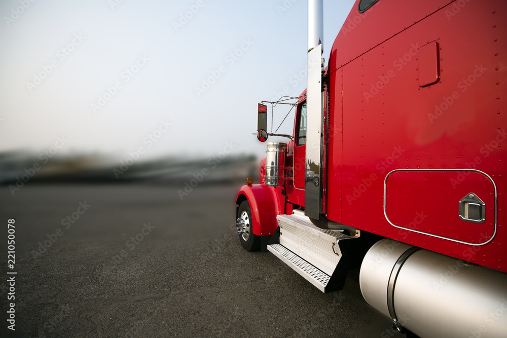 Bright red classic big rig semi truck with chrome pipe and filter ...