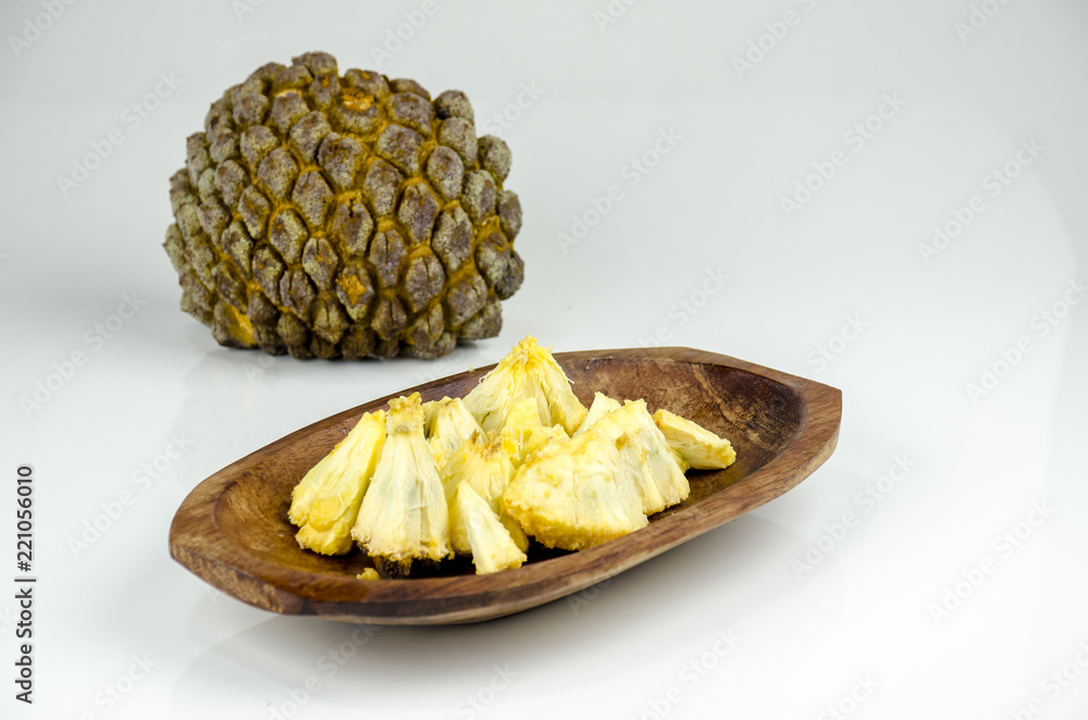 Edible part of marolo, araticum or bruto fruit on wooden bowl ...