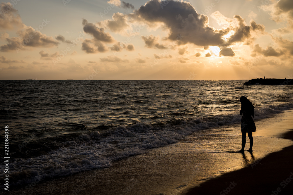 Alone and sad at the beach before sunrise silhouette style Stock Photo ...