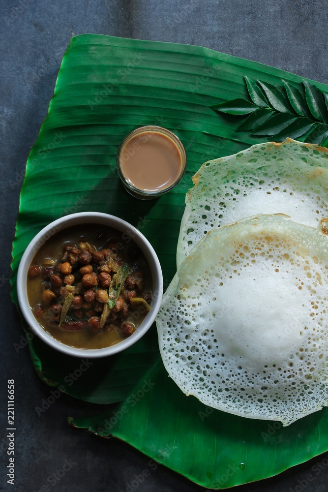 Palappam/ Paalappam - Kerala Appam with Kadala Curry tea on banana leaf ...