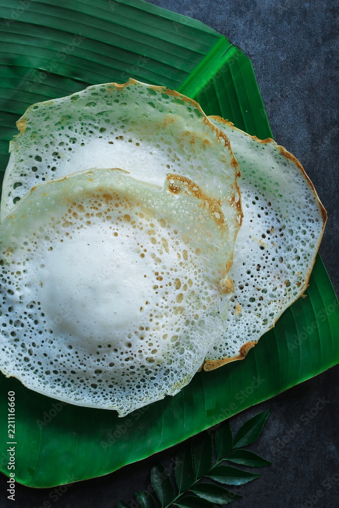 Palappam/ Paalappam - Kerala Appam with Kadala Curry tea on banana leaf ...
