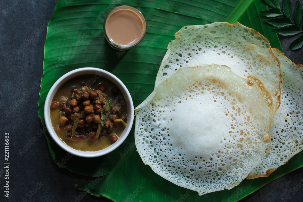 Palappam/ Paalappam - Kerala Appam with Kadala Curry tea on banana leaf ...