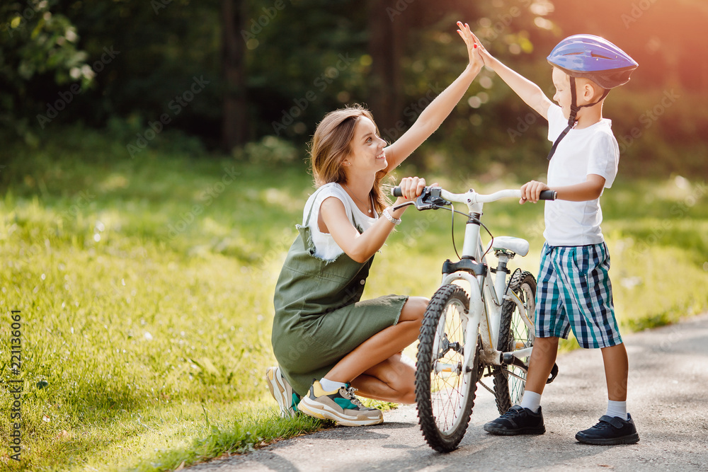 Sister gives five hands to her younger brother for success. Concept of ...
