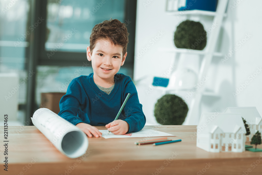 Young talent. Positive talented boy holding pencils while doing a ...