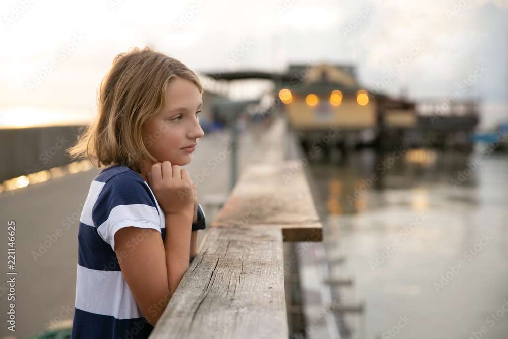 Child Tween Girl on Pier Looking out to Sea Pondering Future Stock ...