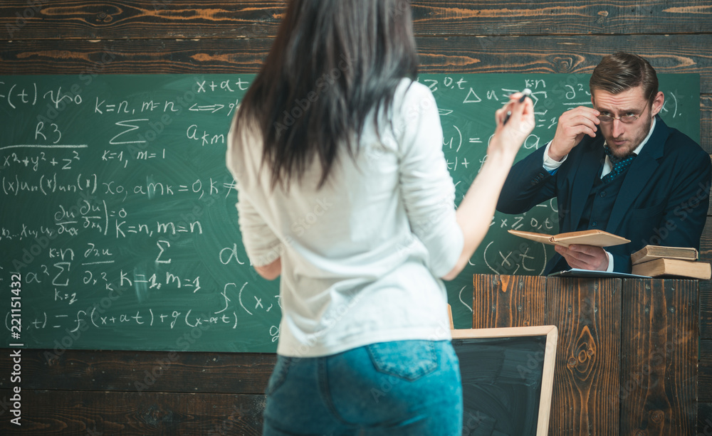 Dedication to teaching. Man teach woman rear view. Teacher and girl ...
