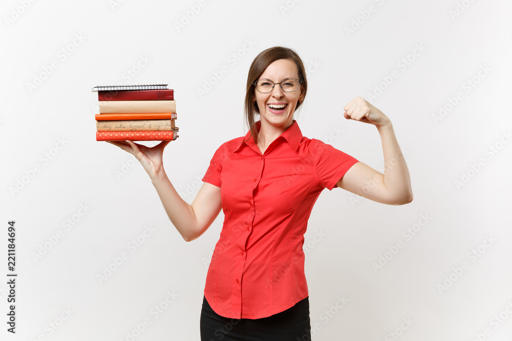 Portrait of strong business teacher woman in red shirt showing biceps ...