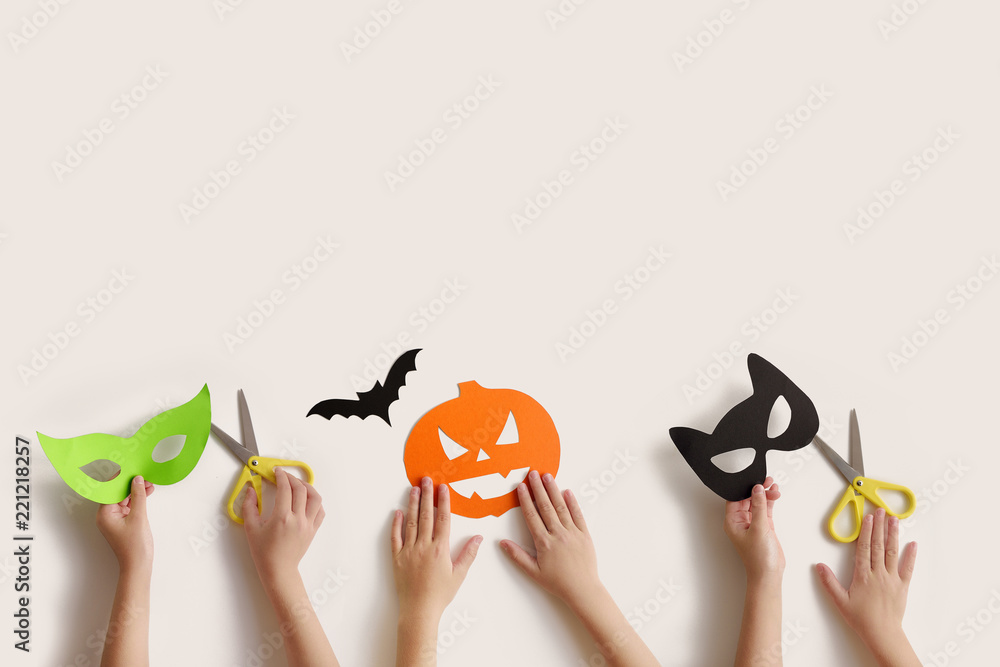 Halloween. The paper masks on a white background which are cut out from ...