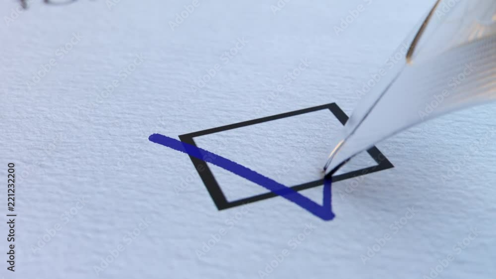 Close up of a quill pen making a check sign with ink in an empty ...