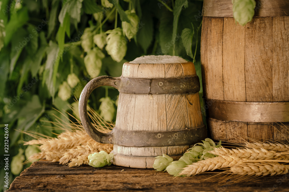 Still Life with keg of beer and draft beer in the ancient wooden mug on ...