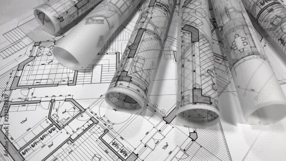 Blueprints - rolls of architectural drawings smoothly rotate on the ...