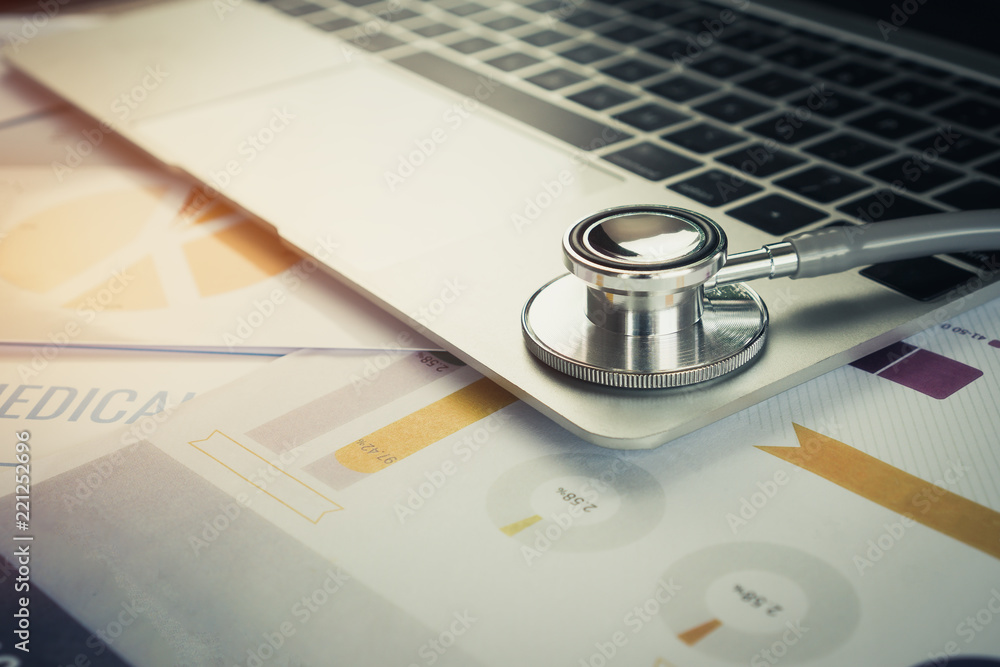 Stethoscope on computer with test results in Doctor consulting room ...