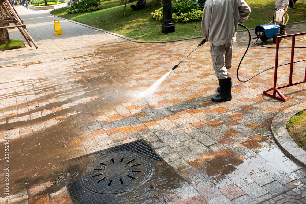 Outdoor floor cleaning with a pressure water jet on street Stock Photo ...
