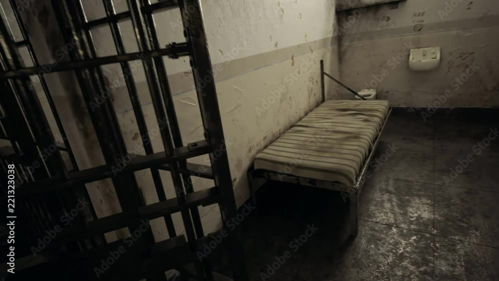 Jail hallway. Prisoner enters into the old awful prison cell and it ...