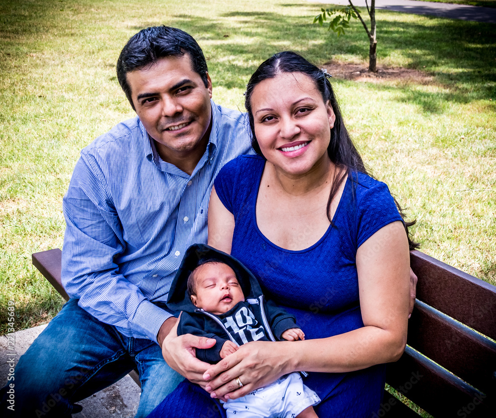 Latino parents with their newborn baby Stock Photo | Adobe Stock