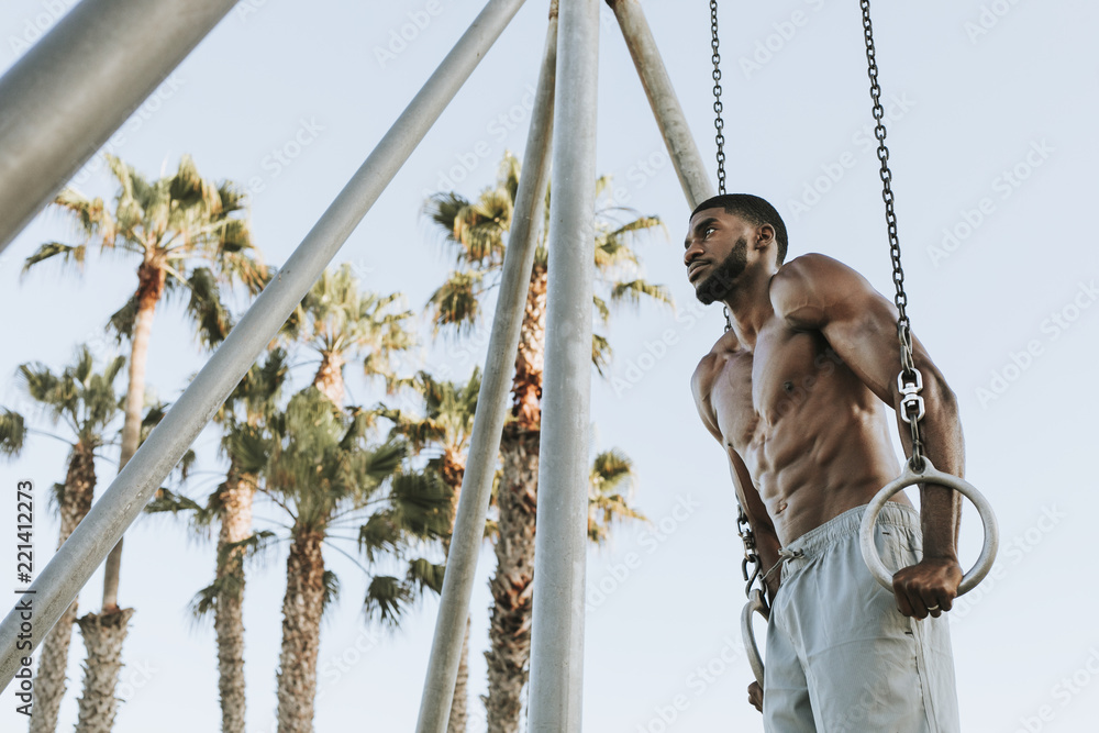 Fit man working out at the beach Stock Photo | Adobe Stock