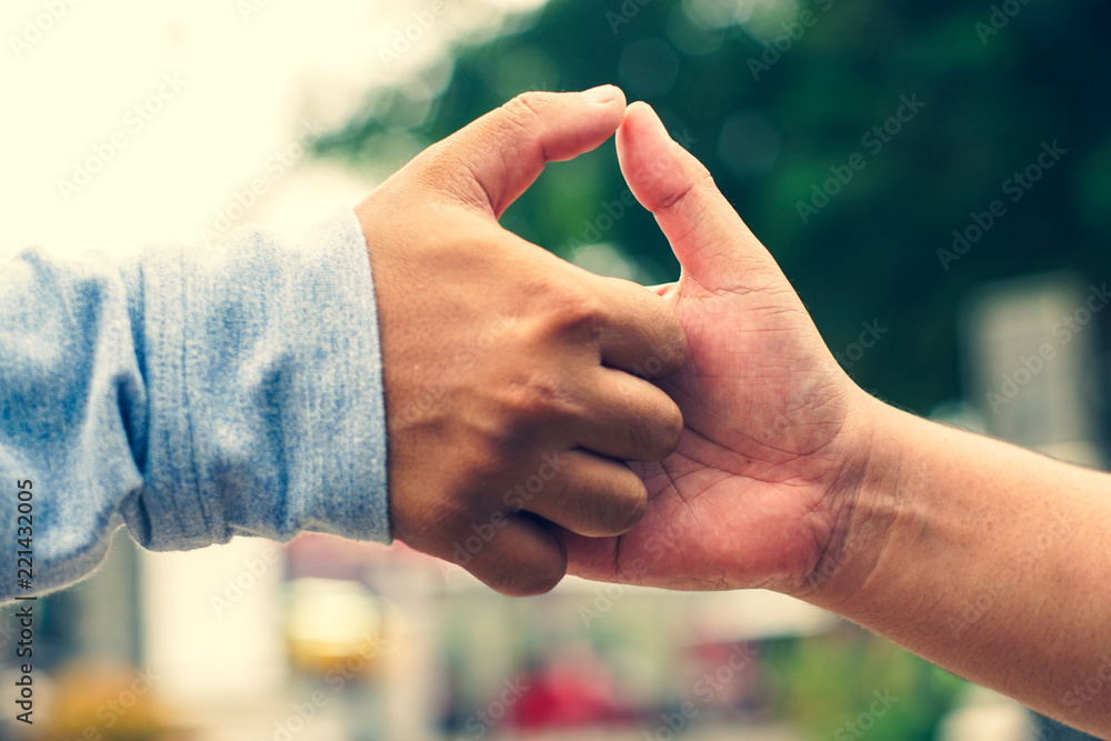 Thumbs war hand finger game on bokeh background Stock Photo | Adobe Stock