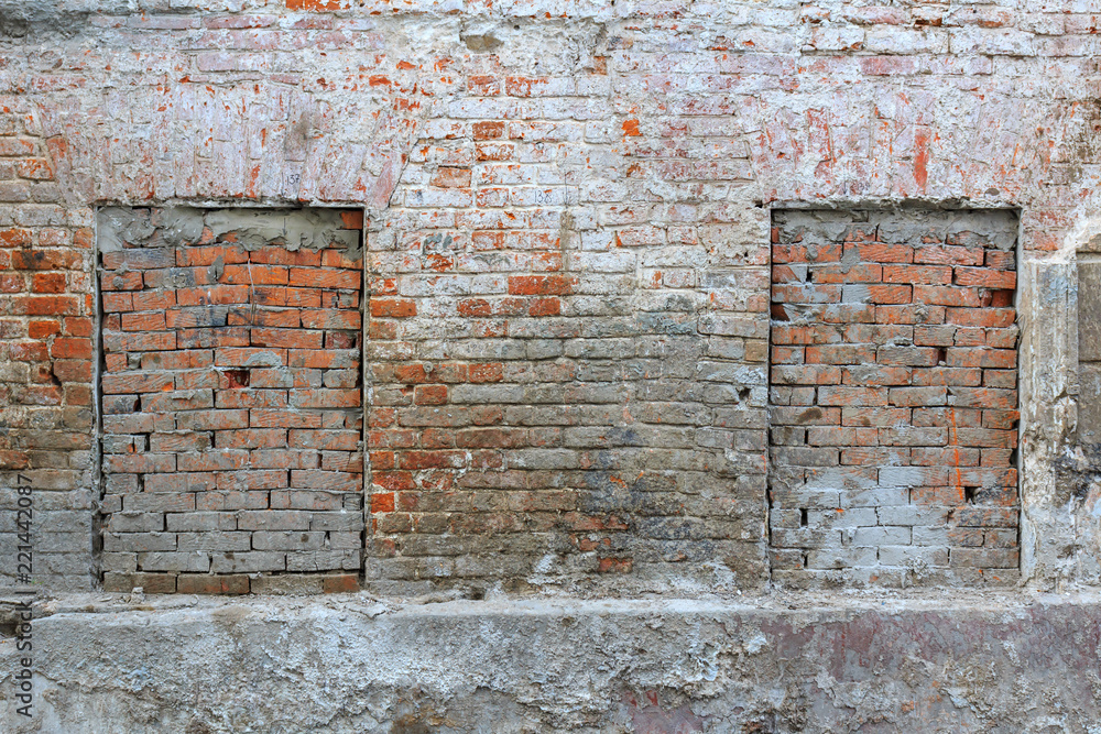 Brick wall of old house with bricked-up windows. Abstract brick wall ...