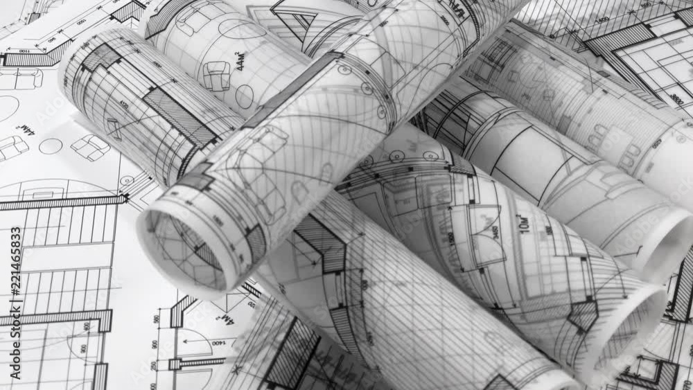 Blueprints - rolls of architectural drawings smoothly rotate on the ...