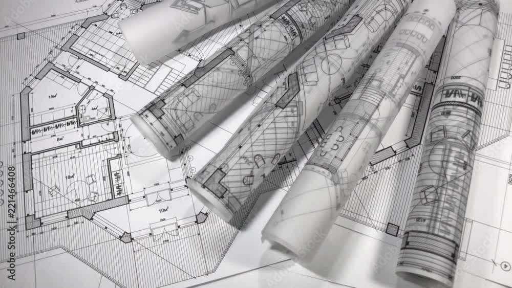 Blueprints - rolls of architectural drawings smoothly rotate on the ...