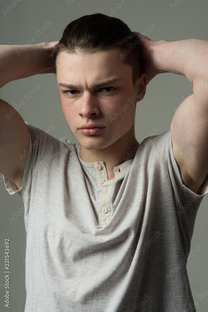 Haircut concept. Man touch hair with hands, haircut. Teenage boy need a ...