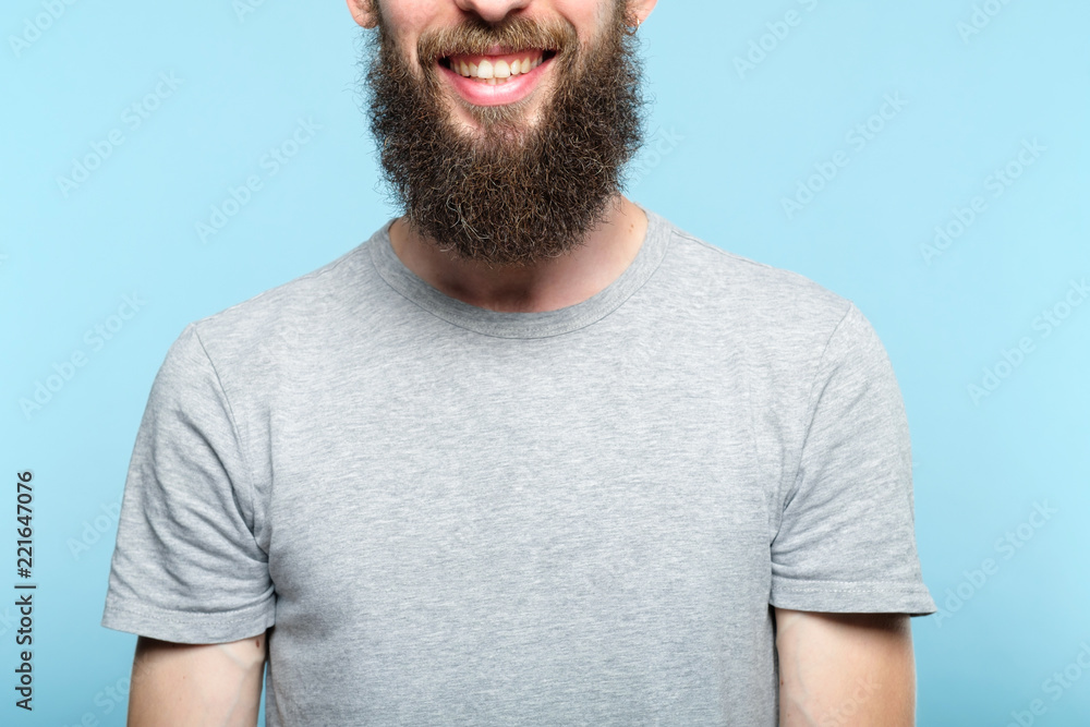 man joyful happy smile. cropped portrait of a young bearded guy on blue ...
