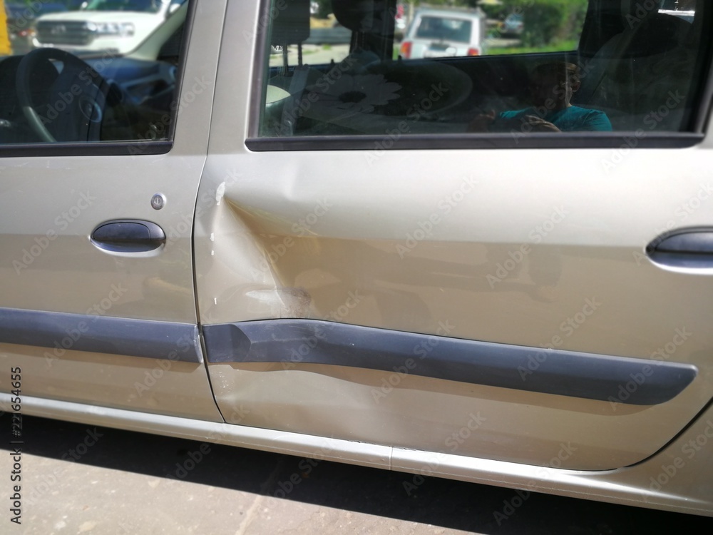 Door car with damage in case of accident with a dent on the left side ...