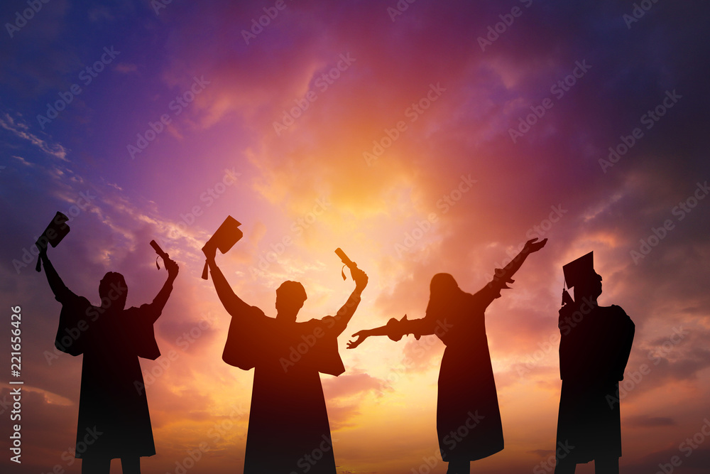 Silhouette of Student Graduation. They are seeing sunset. They are ...