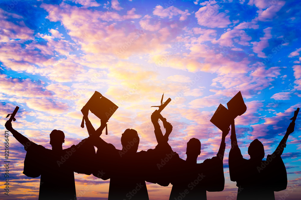 Silhouette of Student Graduation. They are seeing sunset. They are ...