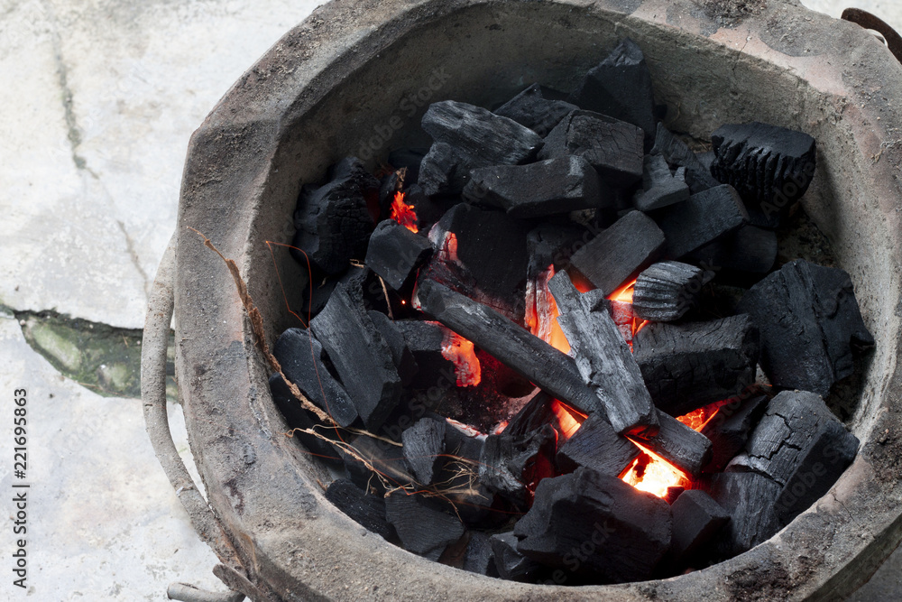 Highly flammable charcoal with fire on the vintage stove. Stock Photo ...
